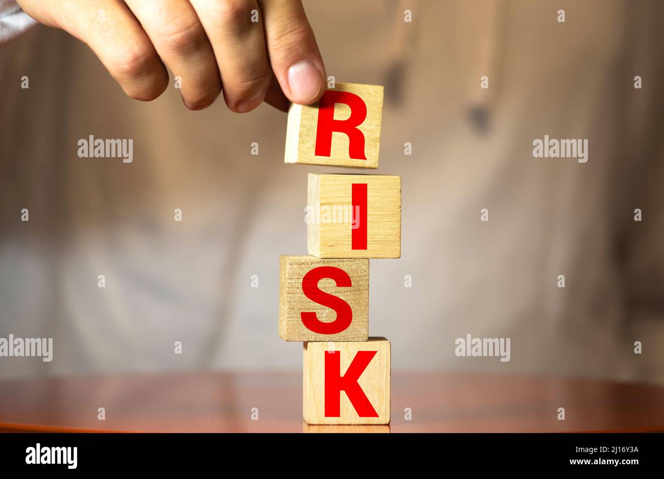 Hand hold wooden cubes with risk word. Risk management concept Stock ...