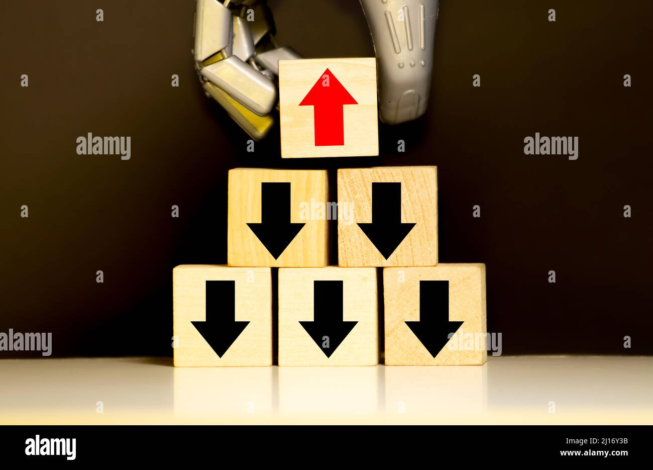 Hand flip over wooden cube block with red arrow facing the opposite ...
