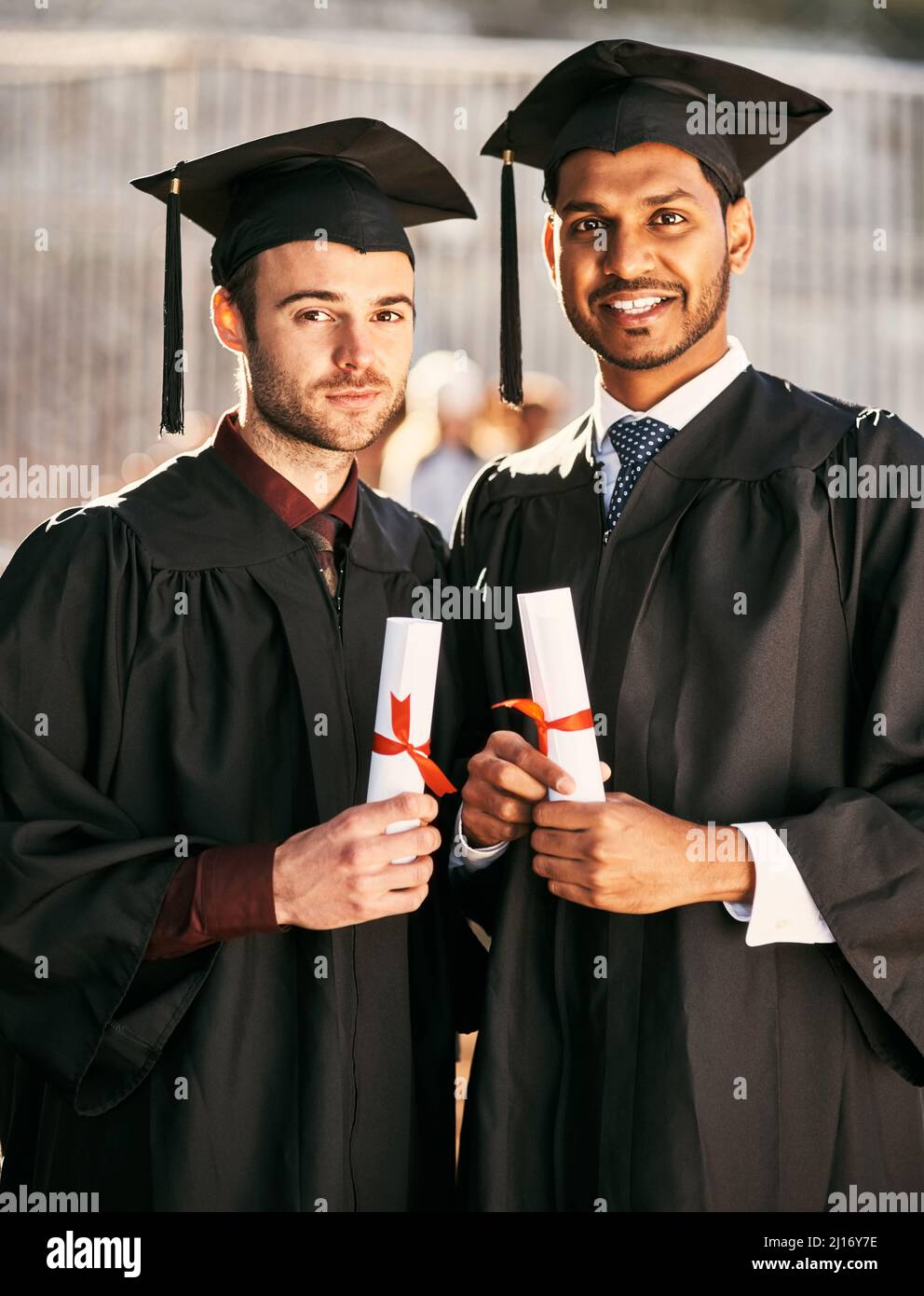 From hard work comes great success. Portrait of two students holding ...