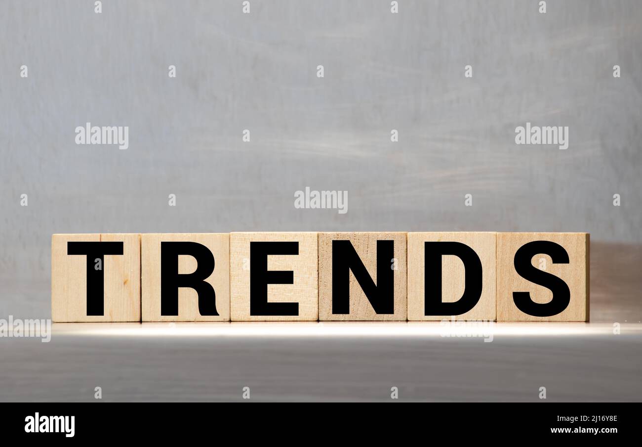 The word TRENDS written in vintage metal letterpress type on a soft ...