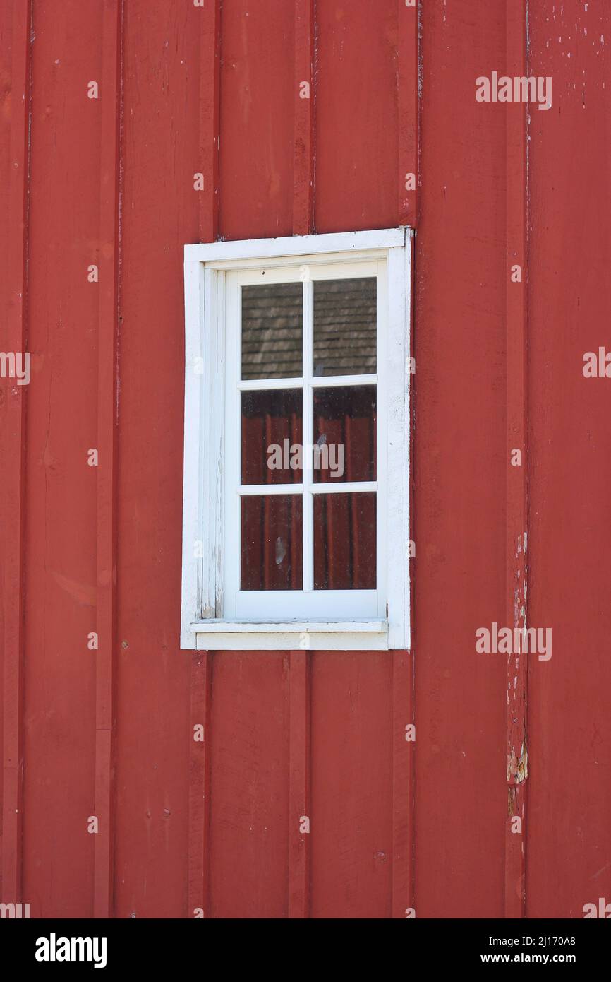 Bright red barn window with white painted frame Stock Photo - Alamy
