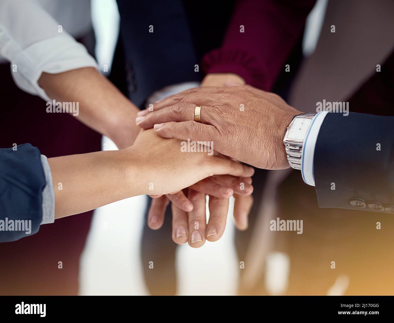 Coming together is success. Cropped shot of a diverse team of ...