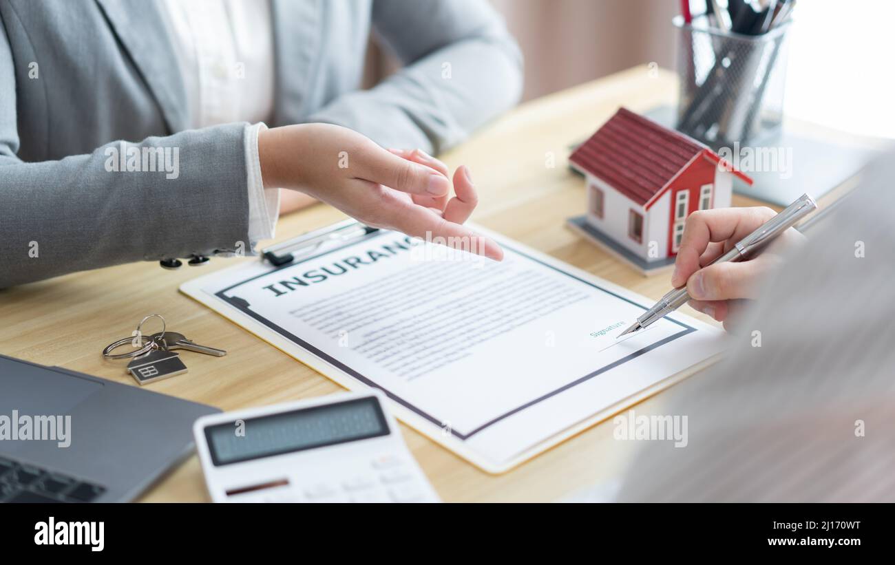 Insurance concept the broker explaining the agreement of the contract ...