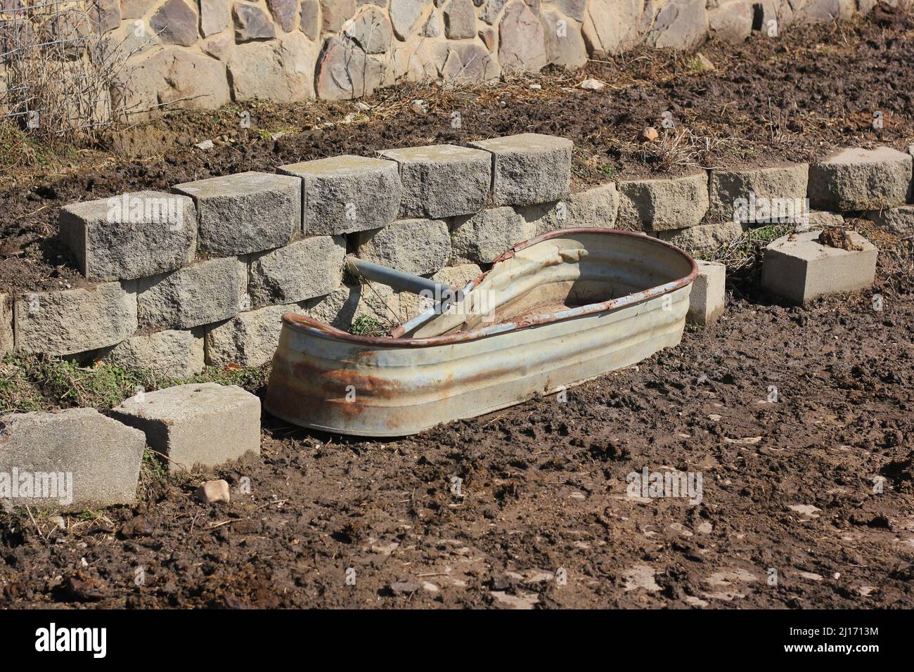 Old metal broken water trough standing out in the fields Stock Photo ...