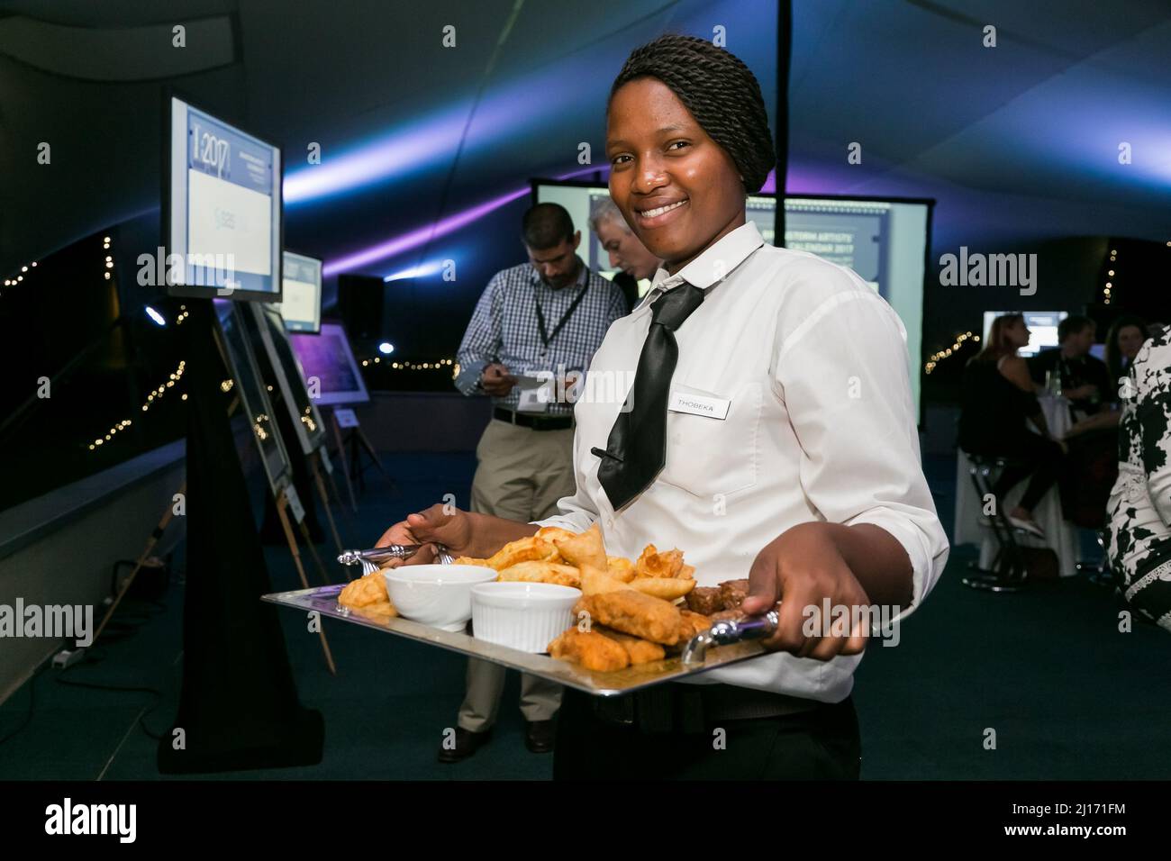 Johannesburg, South Africa - February 16, 2017: Female waitress holding ...