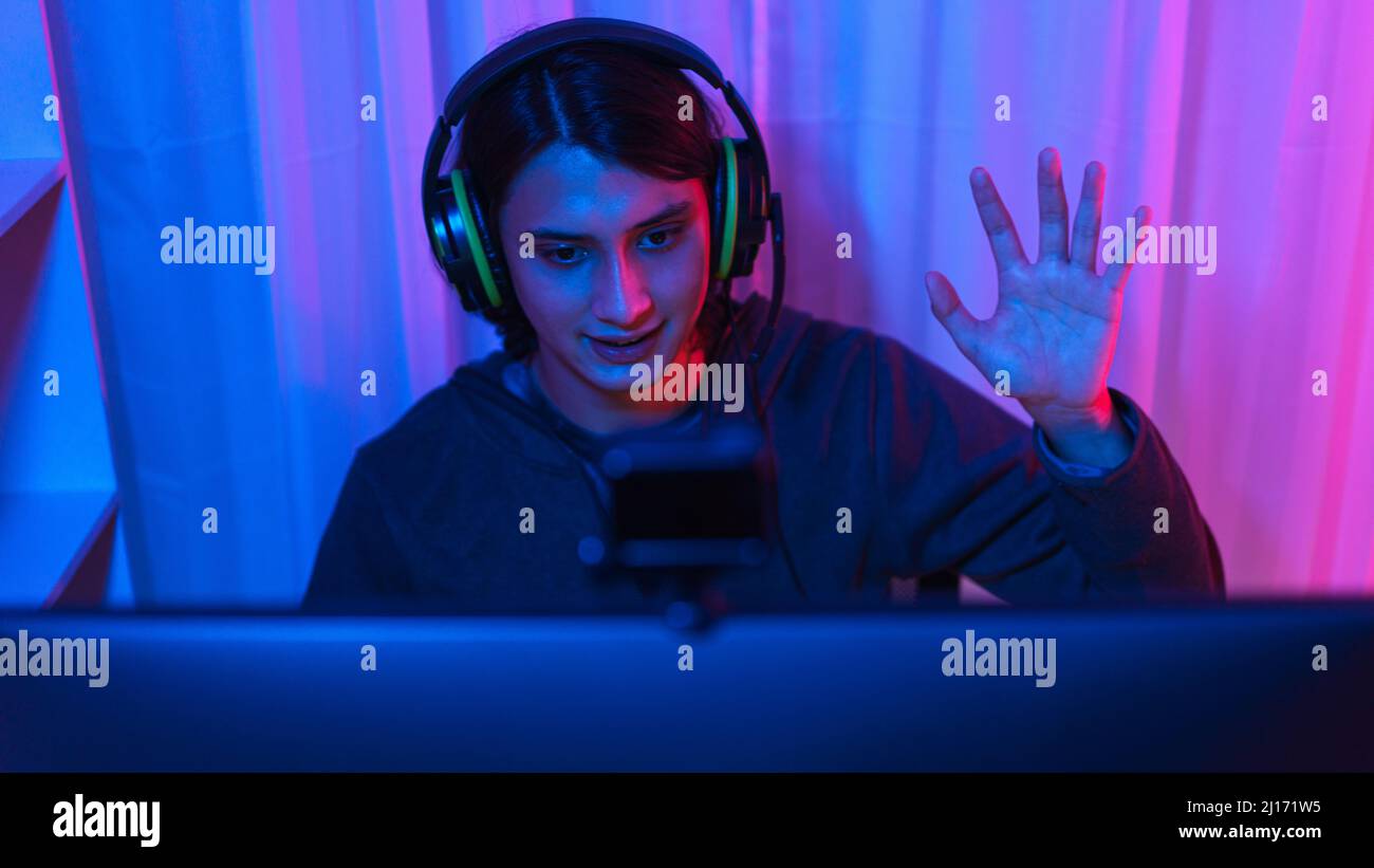 Game stream concept, Male streamer play game online and greeting with ...