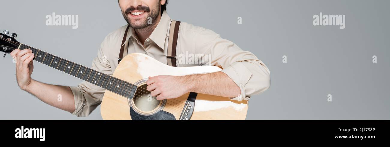 cropped view of cheerful man with mustache in retro style clothing ...