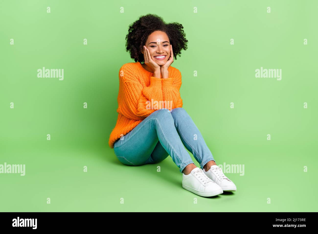 Portrait Of Attractive Cheerful Cute Girl Sitting On Floor Resting