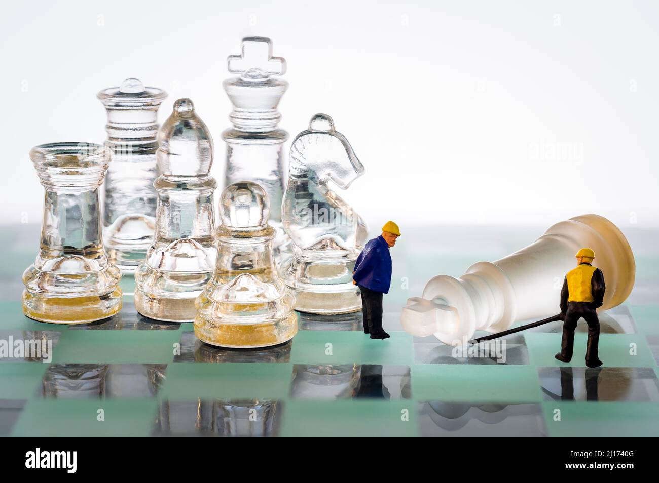 Glass chess pieces, king, queen, knight, bishop, rook and pawn. Fallen ...