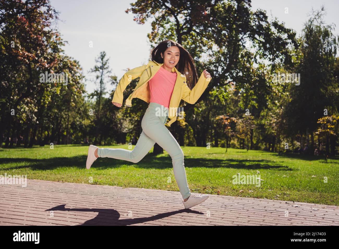 Full length body size view of attractive active cheerful girl jumping ...