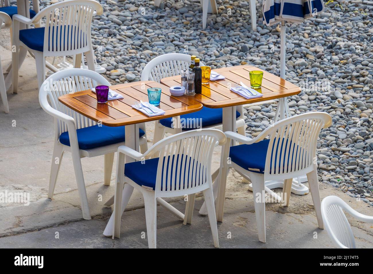 restaurant table on the beach Stock Photo - Alamy