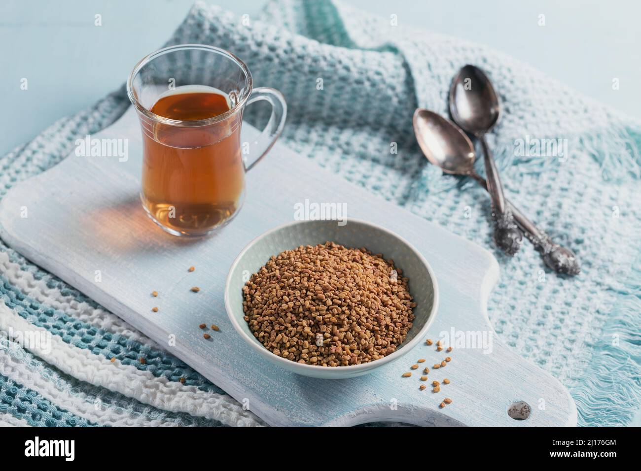 Glass of Egyptian fenugreek yellow tea, Helba or Methi Dana drink and ...