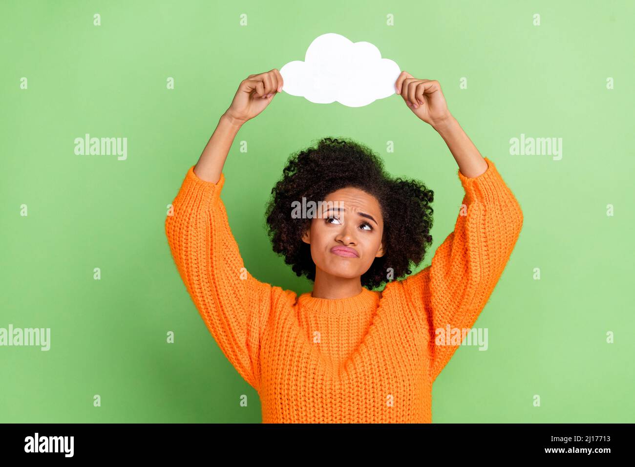 Portrait of attractive desperate girl holding in hand cloud copy space ...