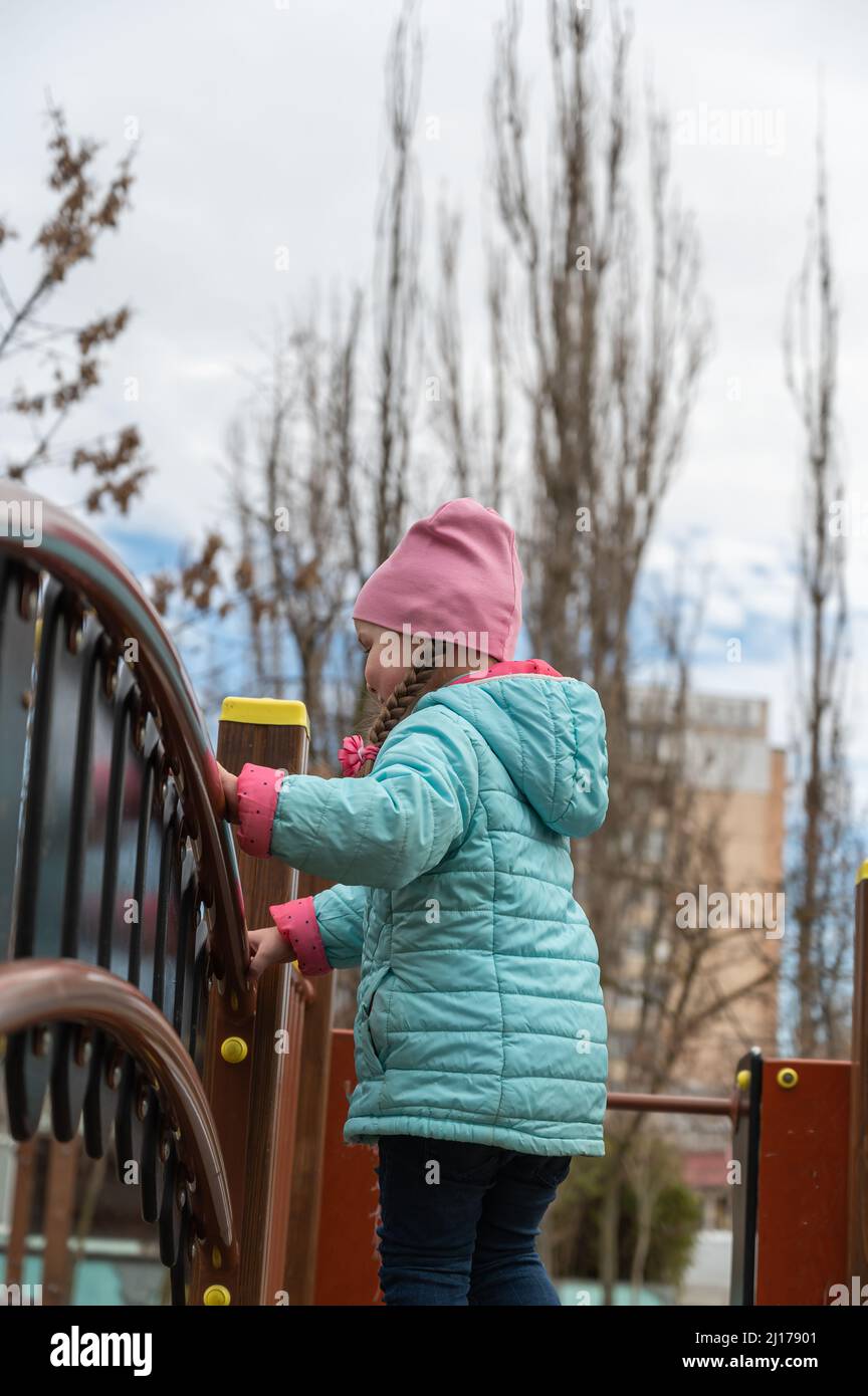 Portrait of a happy preschool child on the playground. A five-year-old ...