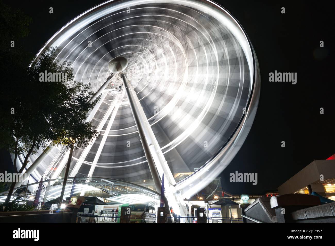 Abstract motion blur of rotating ferris wheel at night on Brisbane ...