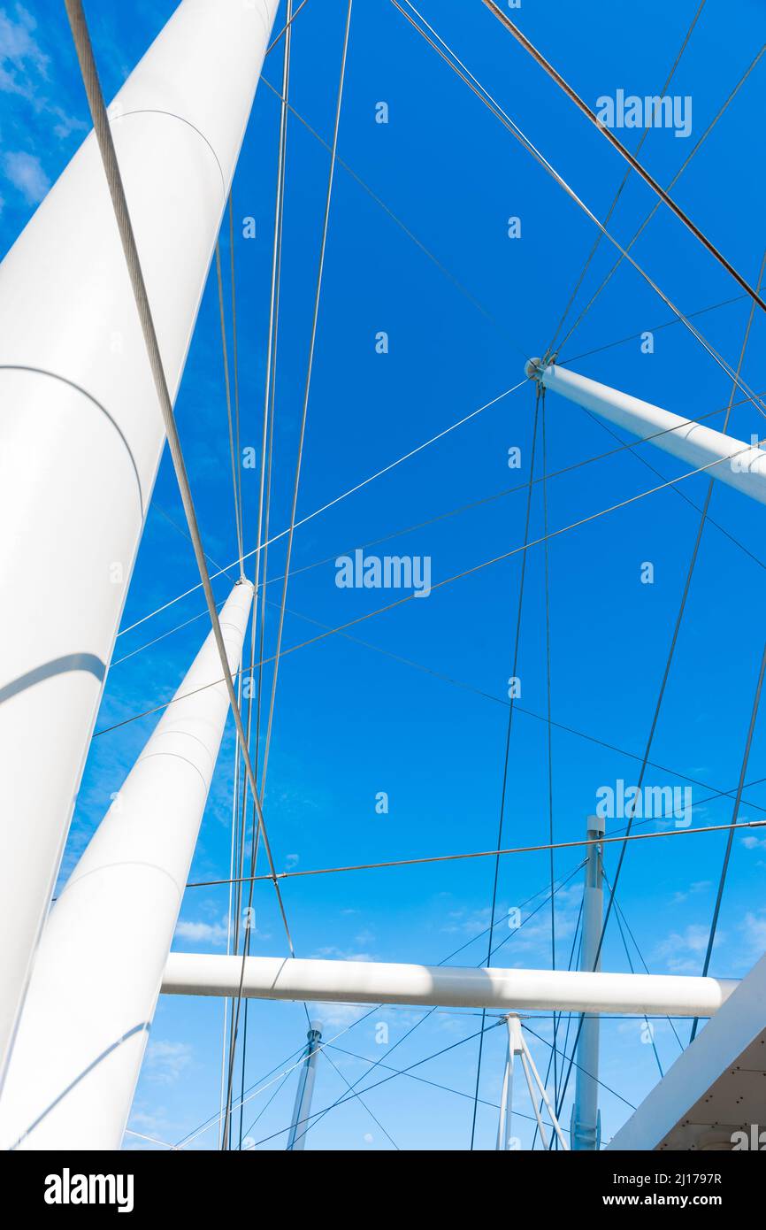 White circular steel structural poles and cables of Kurilpa Bridge ...