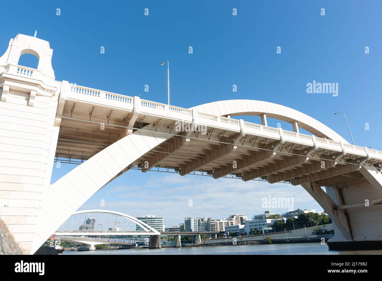 Urban skyline through William Jolley and Merivale arch bridges across ...