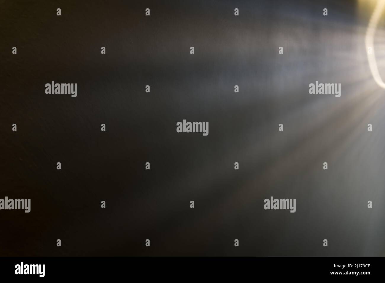 Diagonal beams yellow light on black background from corner Stock Photo ...