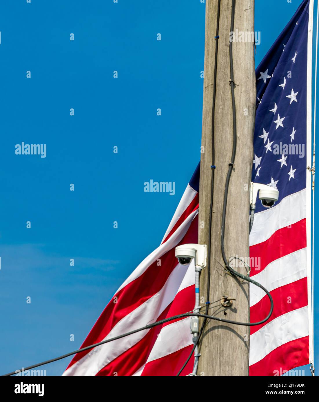 surveillance cameras and an american flag Stock Photo - Alamy