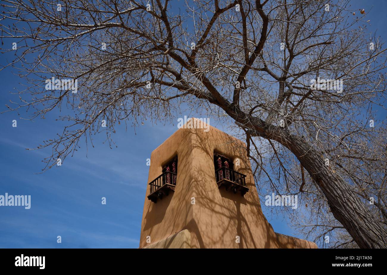 A couple enters the historic Inn on the Alameda hotel in the historic ...