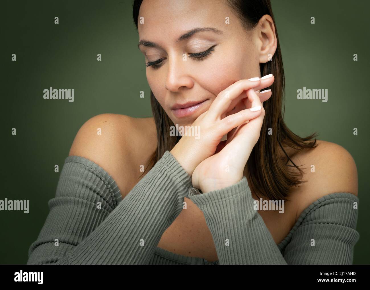 Beautiful woman with off shoulder top in studio Stock Photo - Alamy