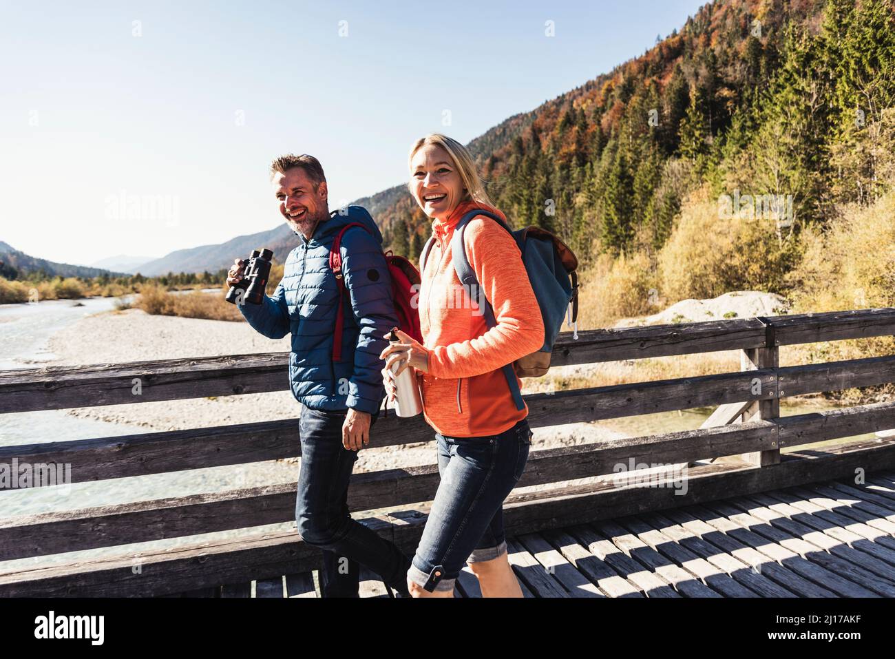 2 two people crossing wooden bridge hi-res stock photography and images ...