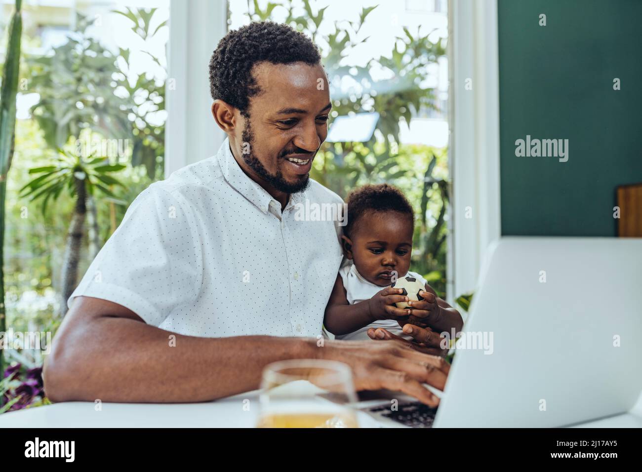 Smiling father son using hi-res stock photography and images - Alamy
