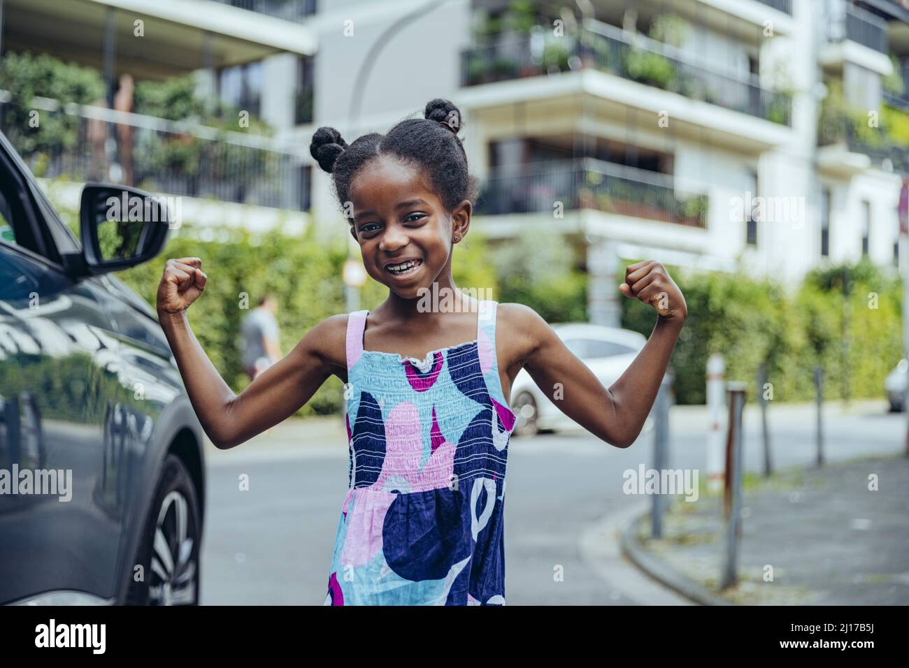 Girl flexing muscles hi-res stock photography and images - Alamy