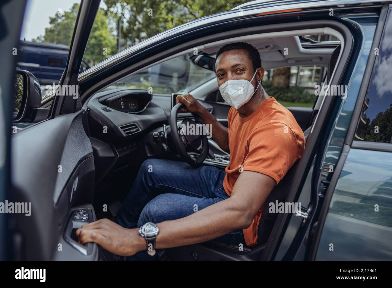 Mask in car hi-res stock photography and images - Alamy