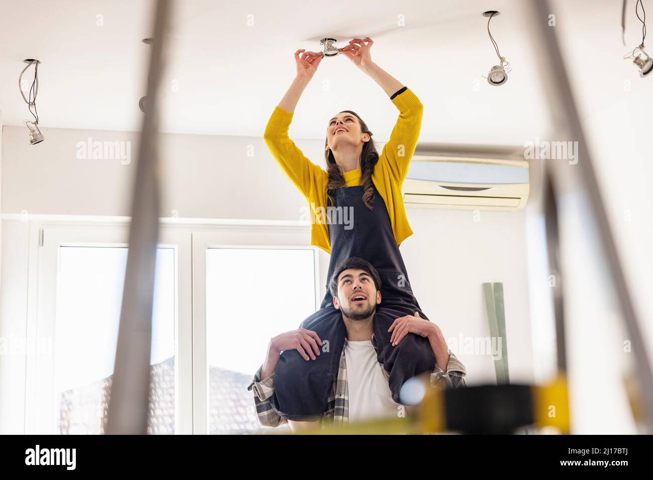 Person changing a lightbulb hi-res stock photography and images - Alamy
