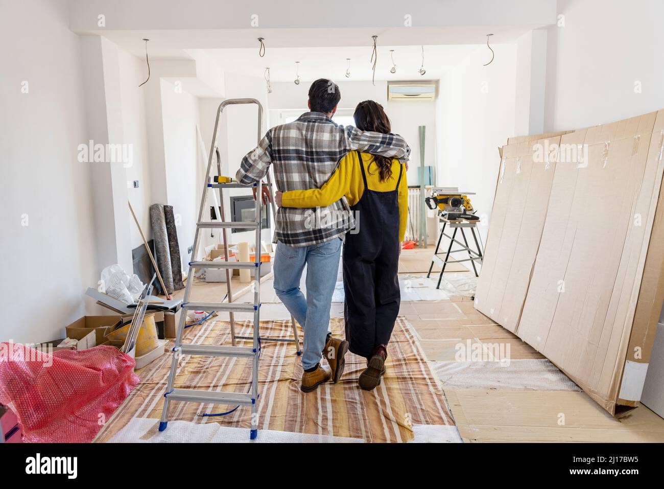 Arms around legs hi-res stock photography and images - Alamy