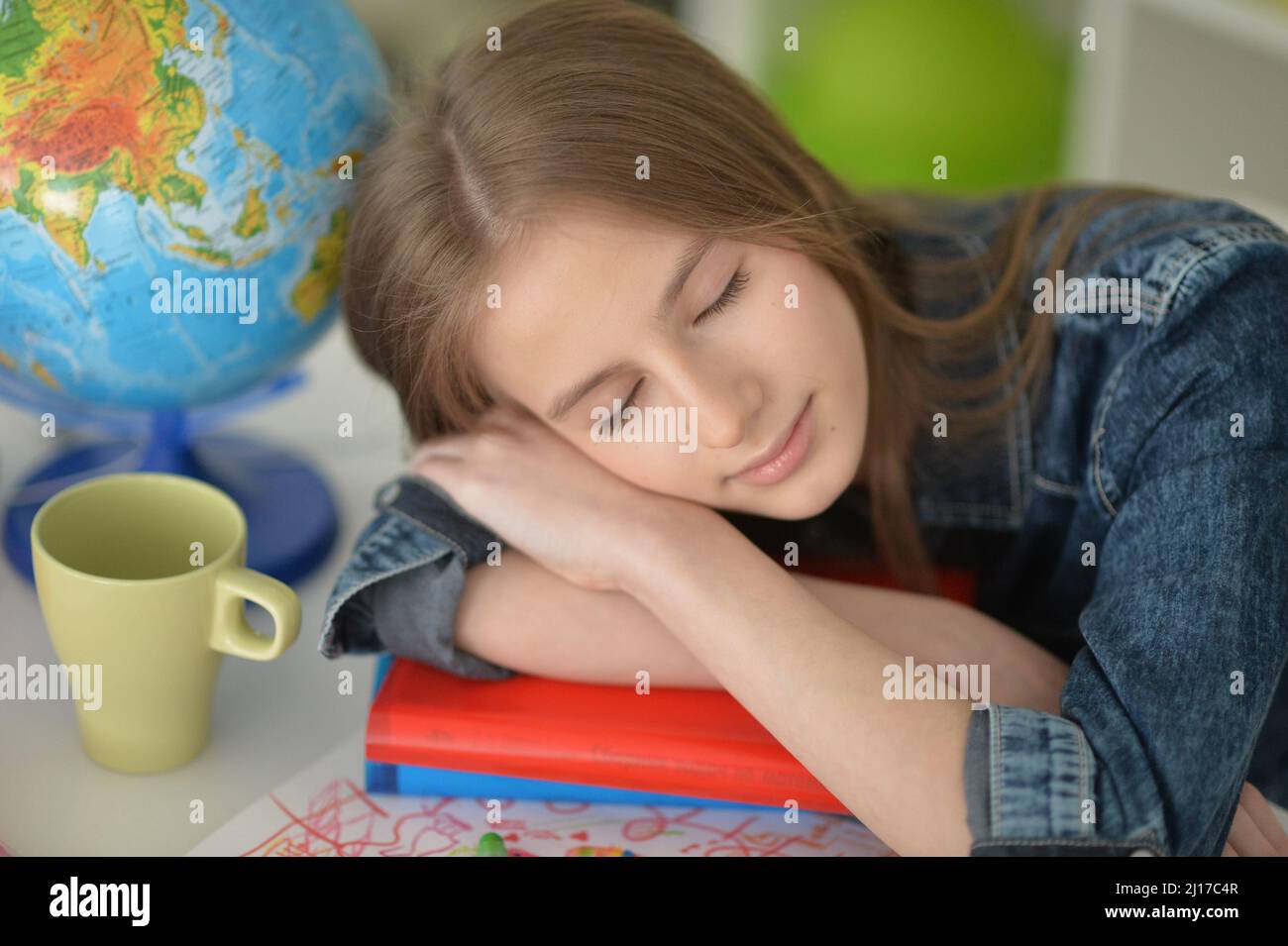 Cute schoolgirl sleeping at her homework at home Stock Photo - Alamy