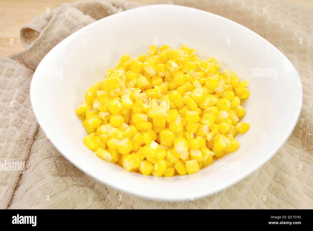 A side dish of sweet yellow corn in a white hi-res stock photography ...