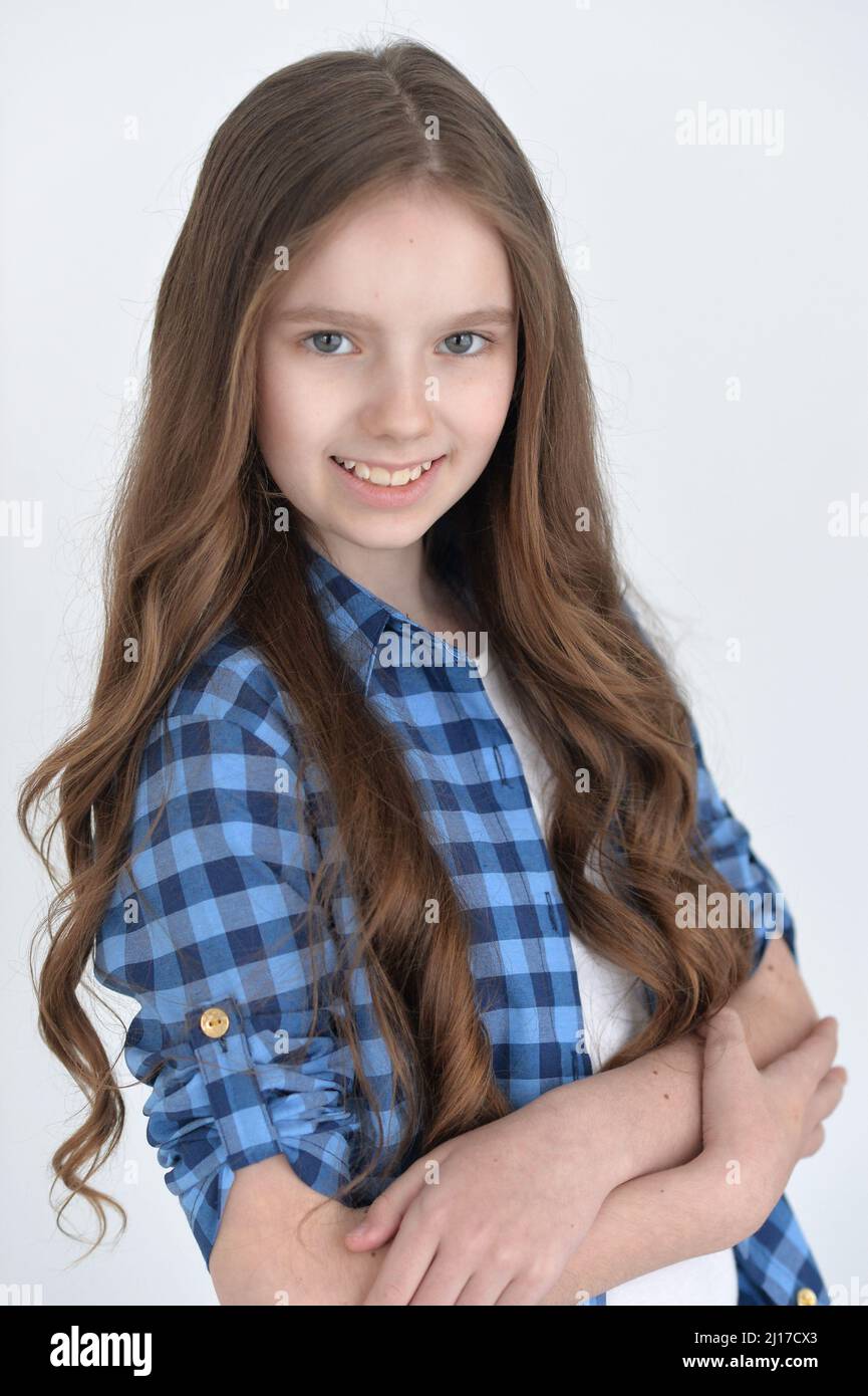 Cute girl looking at camera isolated on white background Stock Photo ...