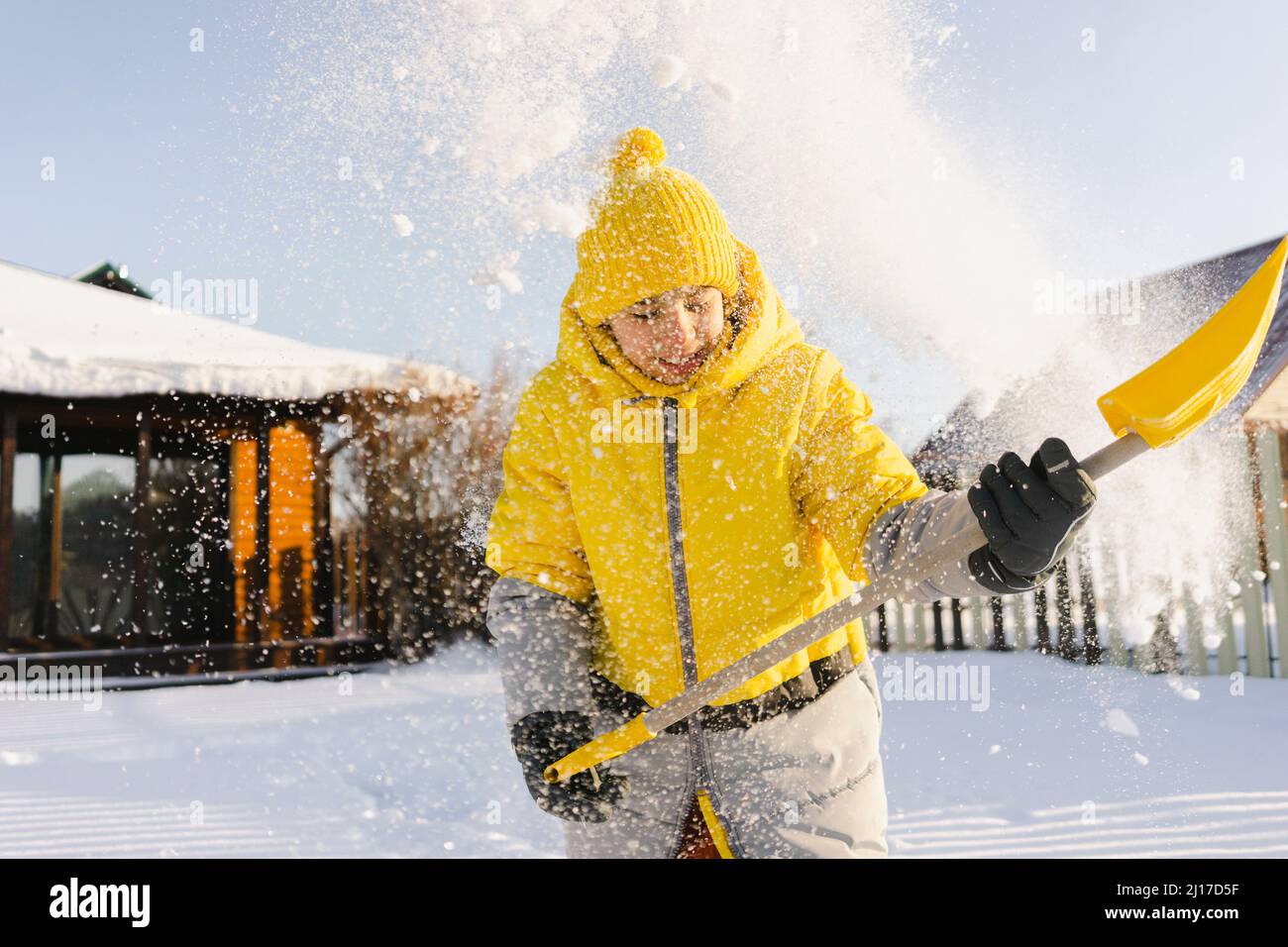 Children shovel snow hi-res stock photography and images - Alamy