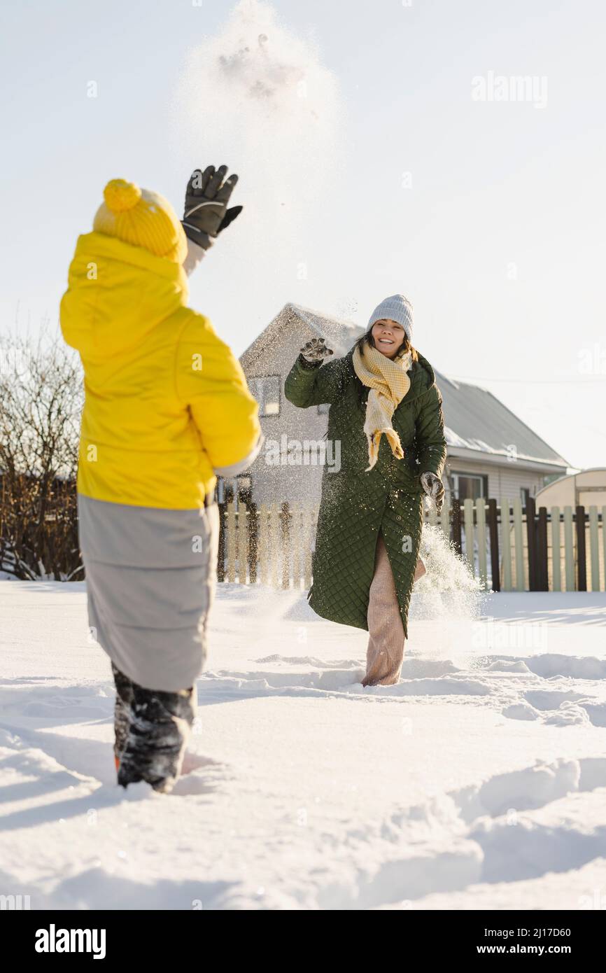Children throwing snow in hi-res stock photography and images - Alamy