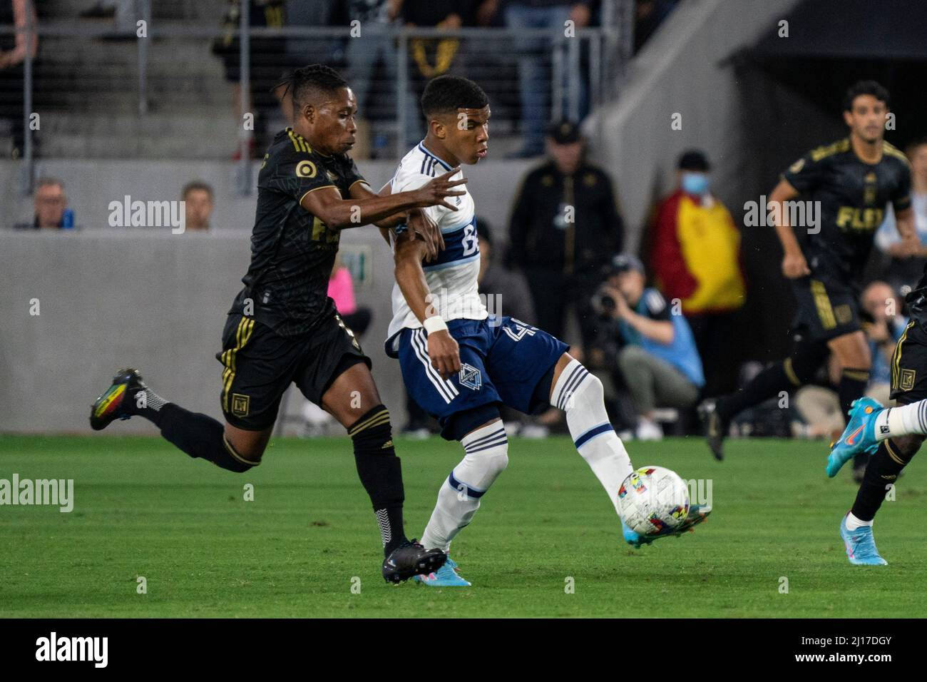Vancouver Whitecaps midfielder Pedro Vite (45) is defended by Los Angeles FC forward Latif ...