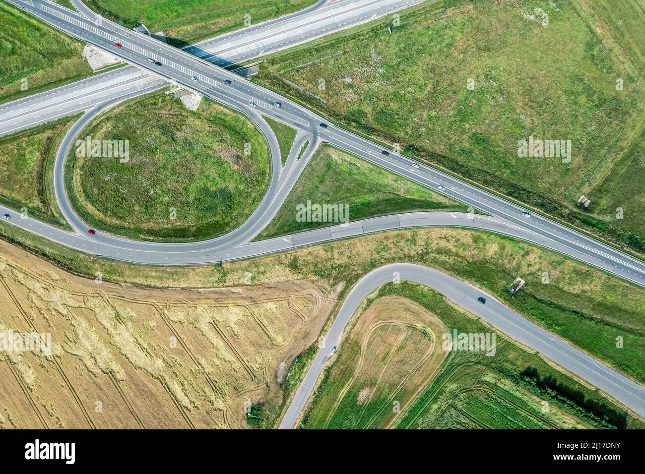 highway intersections road between fields. aerial top view from flying ...