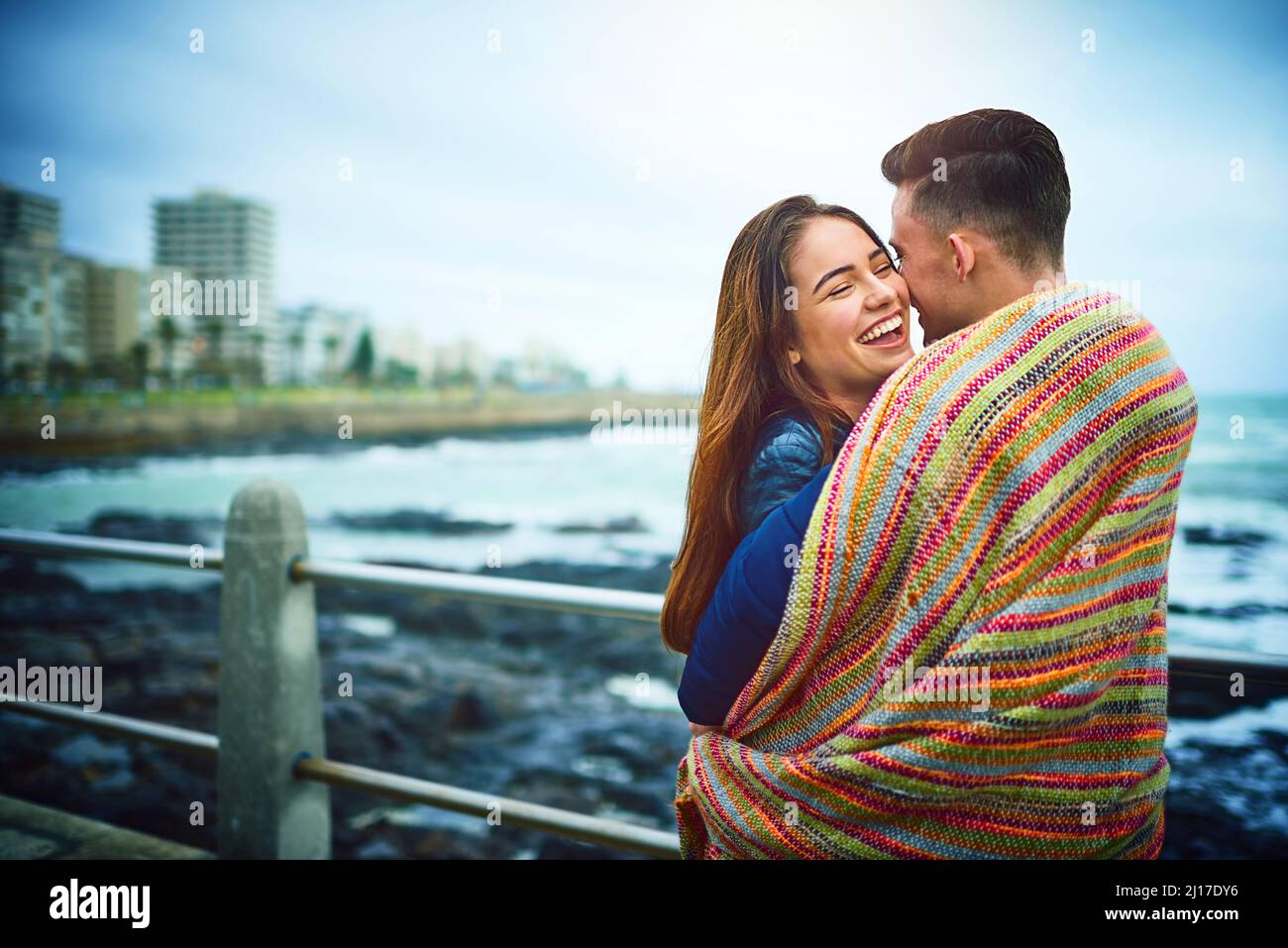 Who said you need a bed to cuddle. Shot of a happy young couple ...