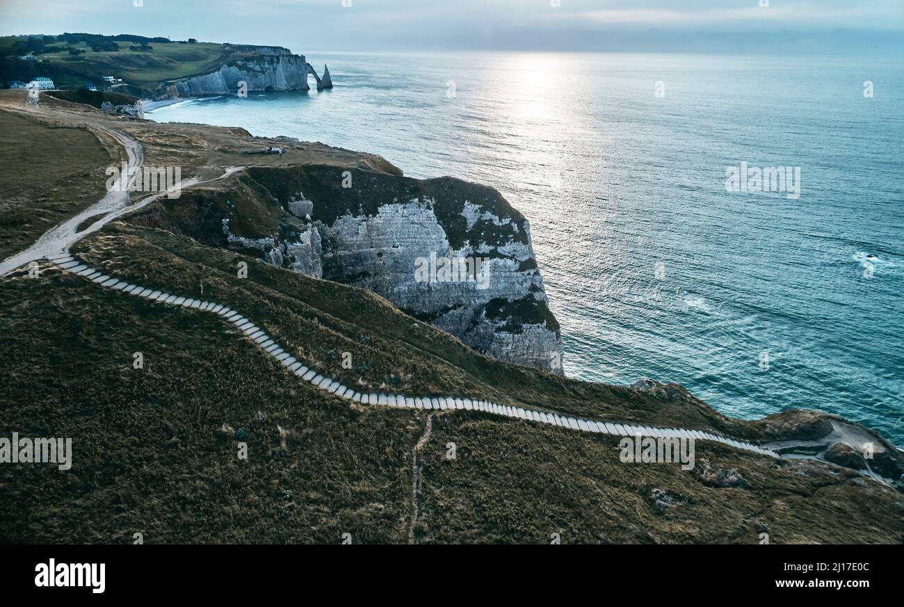 Path at rock formation by sea Stock Photo - Alamy