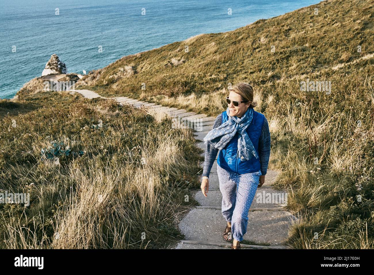 Woman walking path hi-res stock photography and images - Alamy
