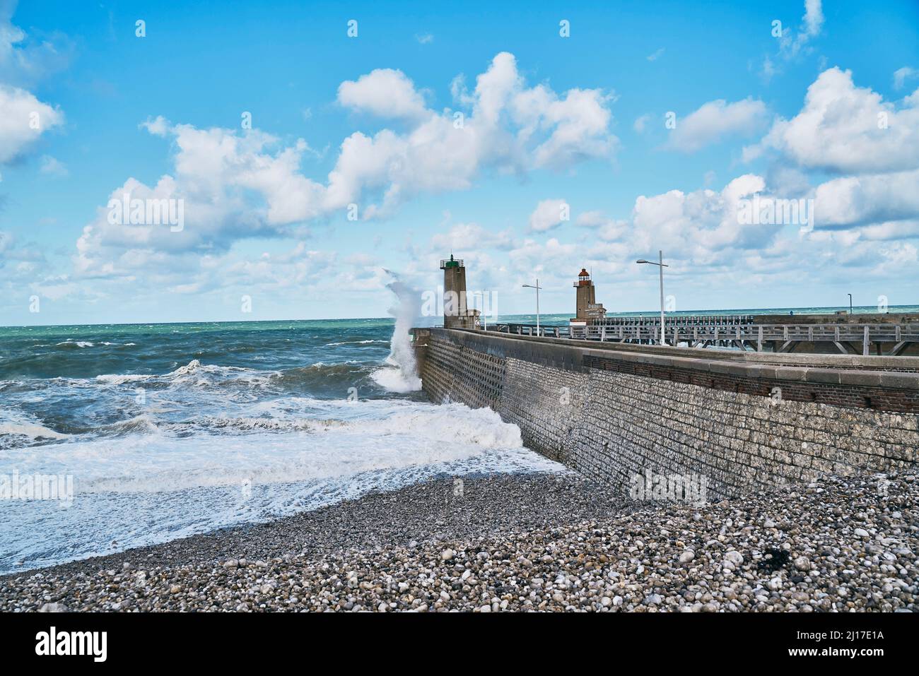 Waves splashing on wall at beach Stock Photo - Alamy