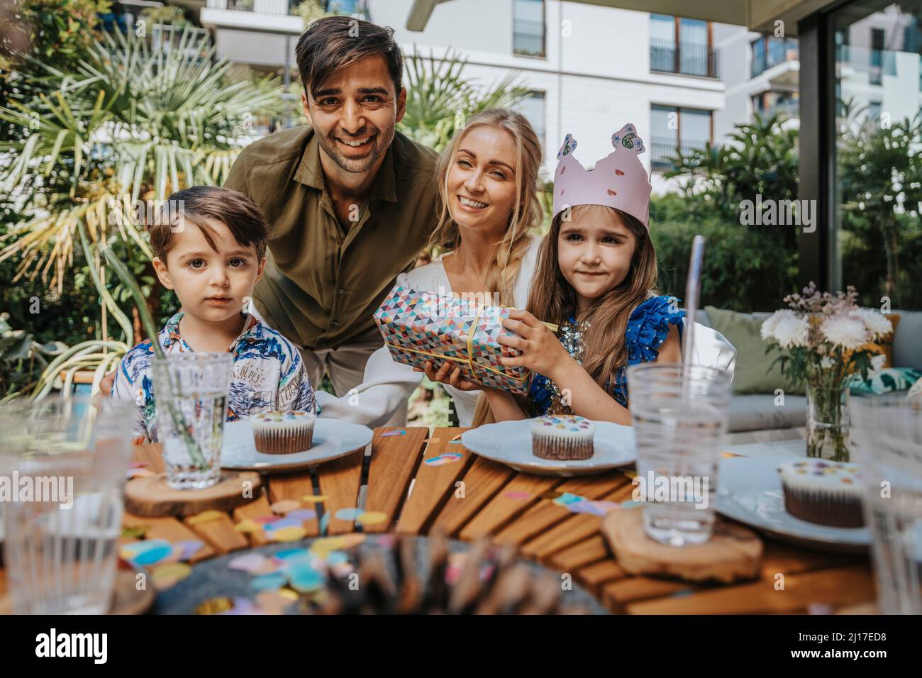 Smiling parents with children on birthday party Stock Photo - Alamy