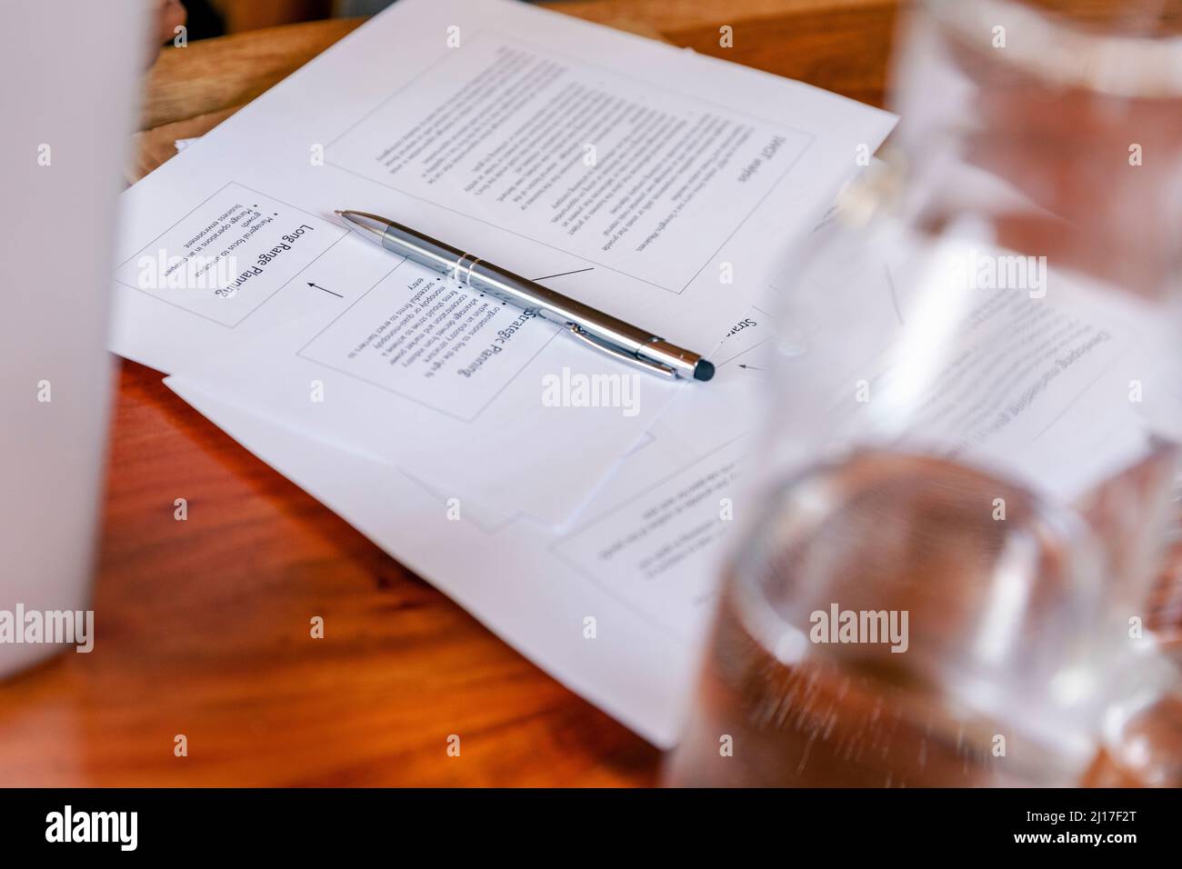 Paper documents and pen on desk Stock Photo - Alamy