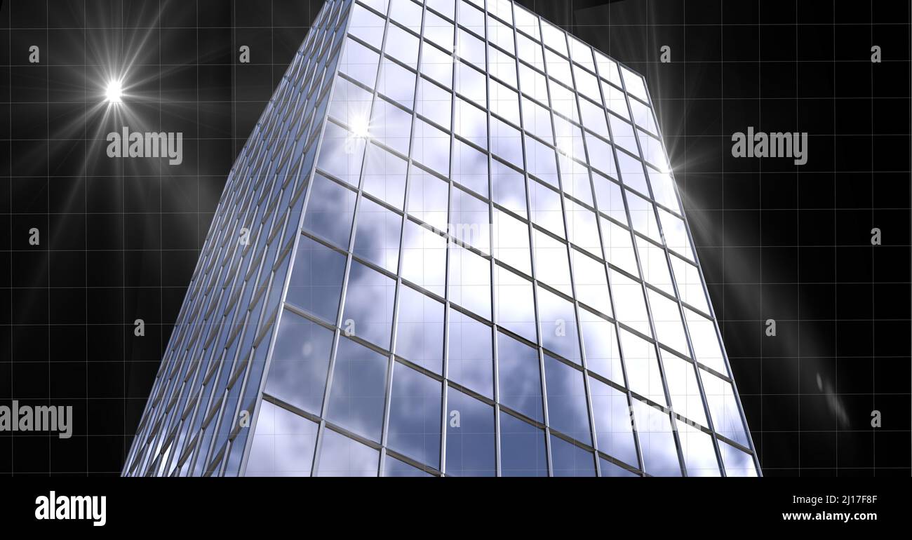 Spots of lights over tall building model against black background Stock ...