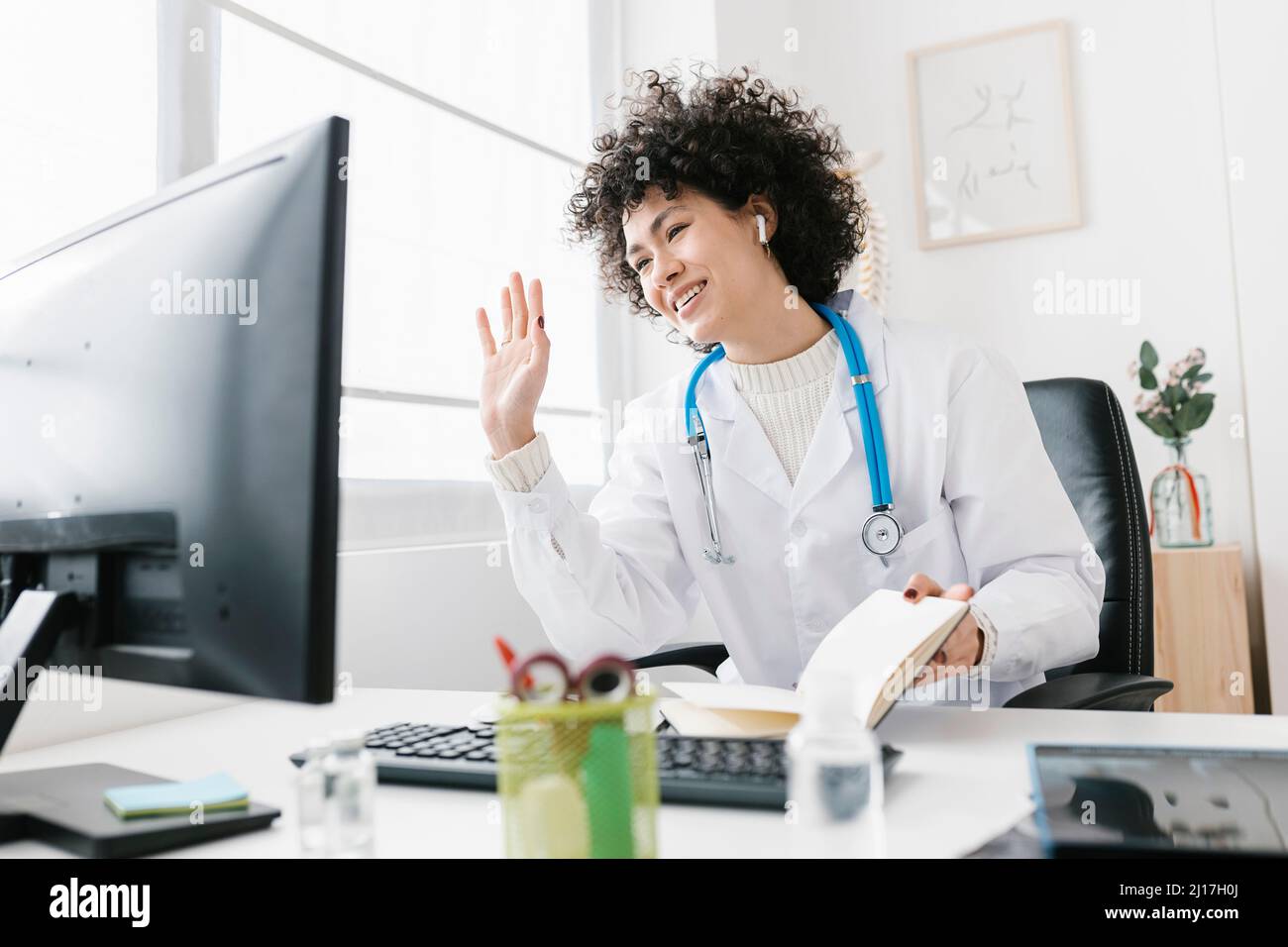 Hand through computer screen hi-res stock photography and images - Alamy