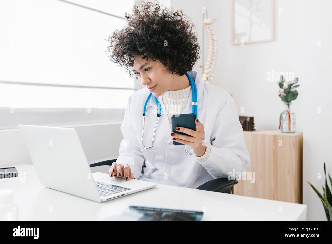 Young smart female doctor computer hi-res stock photography and images ...