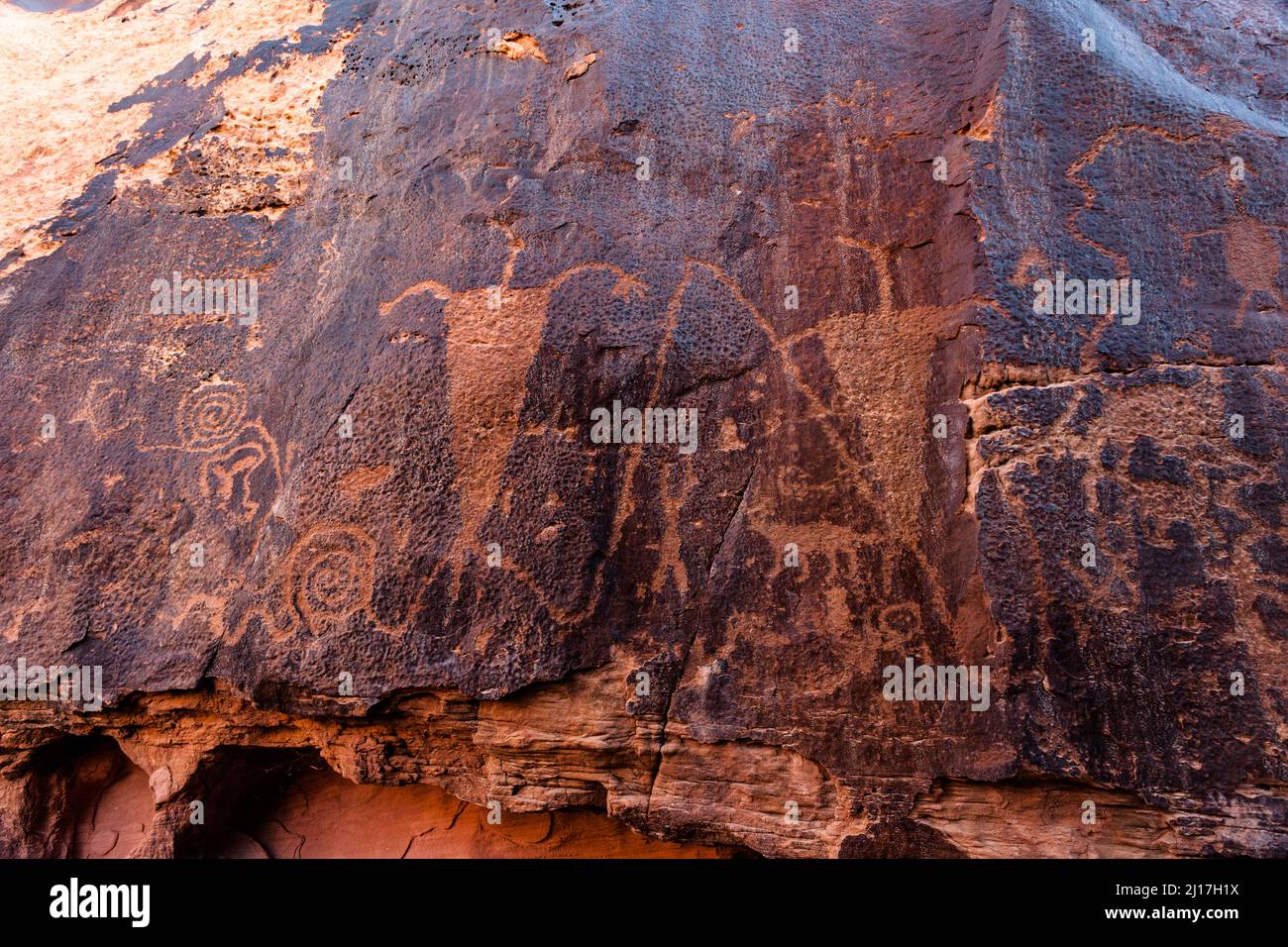 Ancestral Puebloan Native American rock art on the dark desert ...