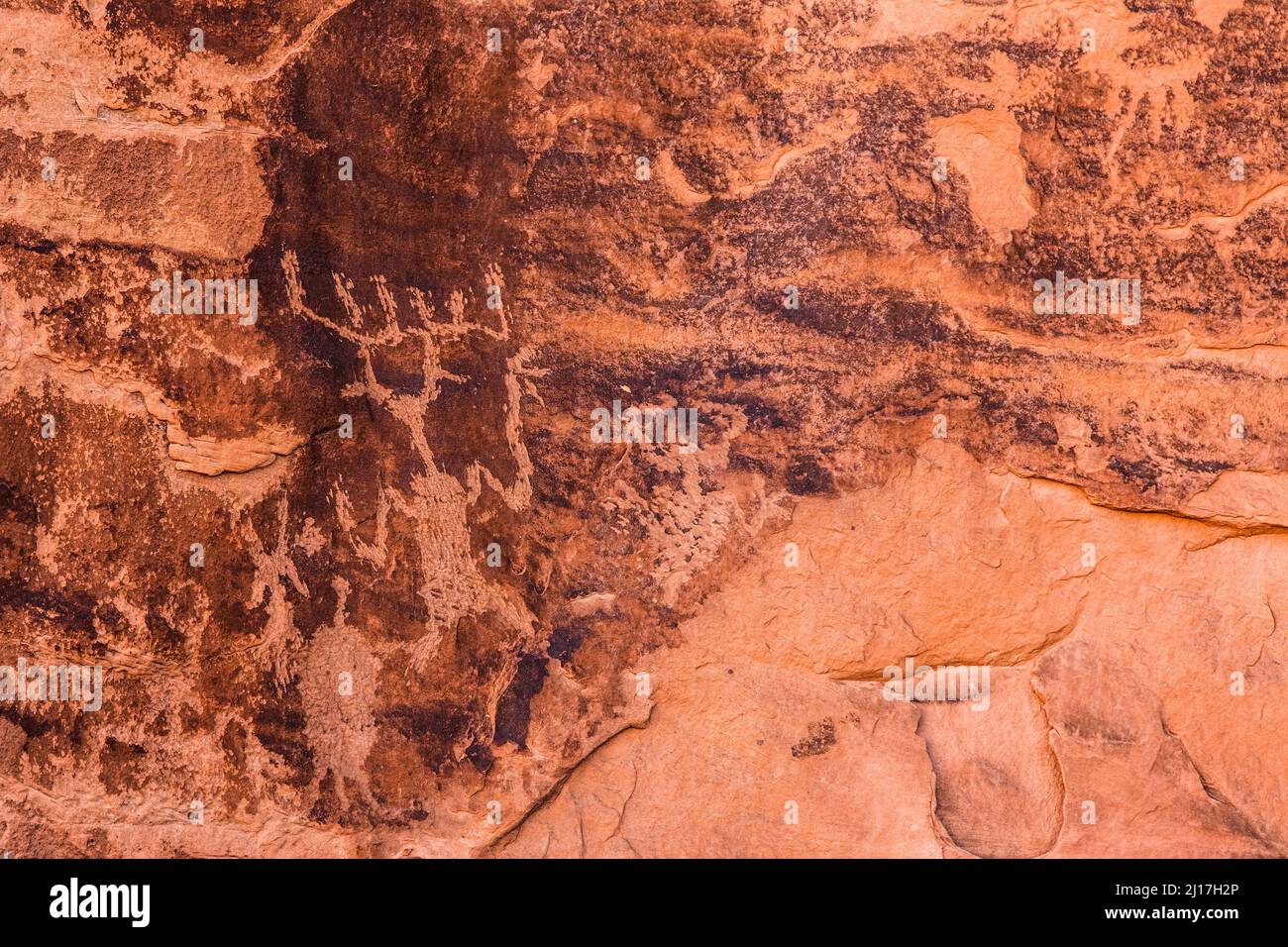Ancestral Puebloan Native American rock art on the dark desert ...