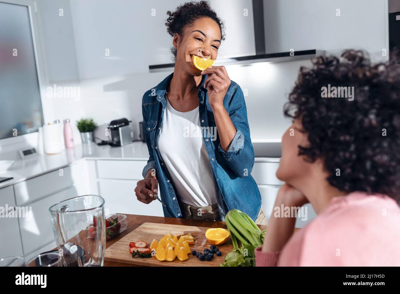 Covering mouth while eating hi-res stock photography and images - Alamy